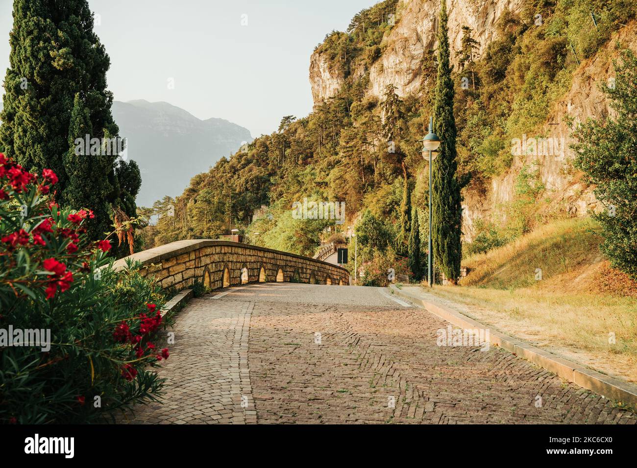 A bridge between mountains surrounded by greenery Stock Photo - Alamy