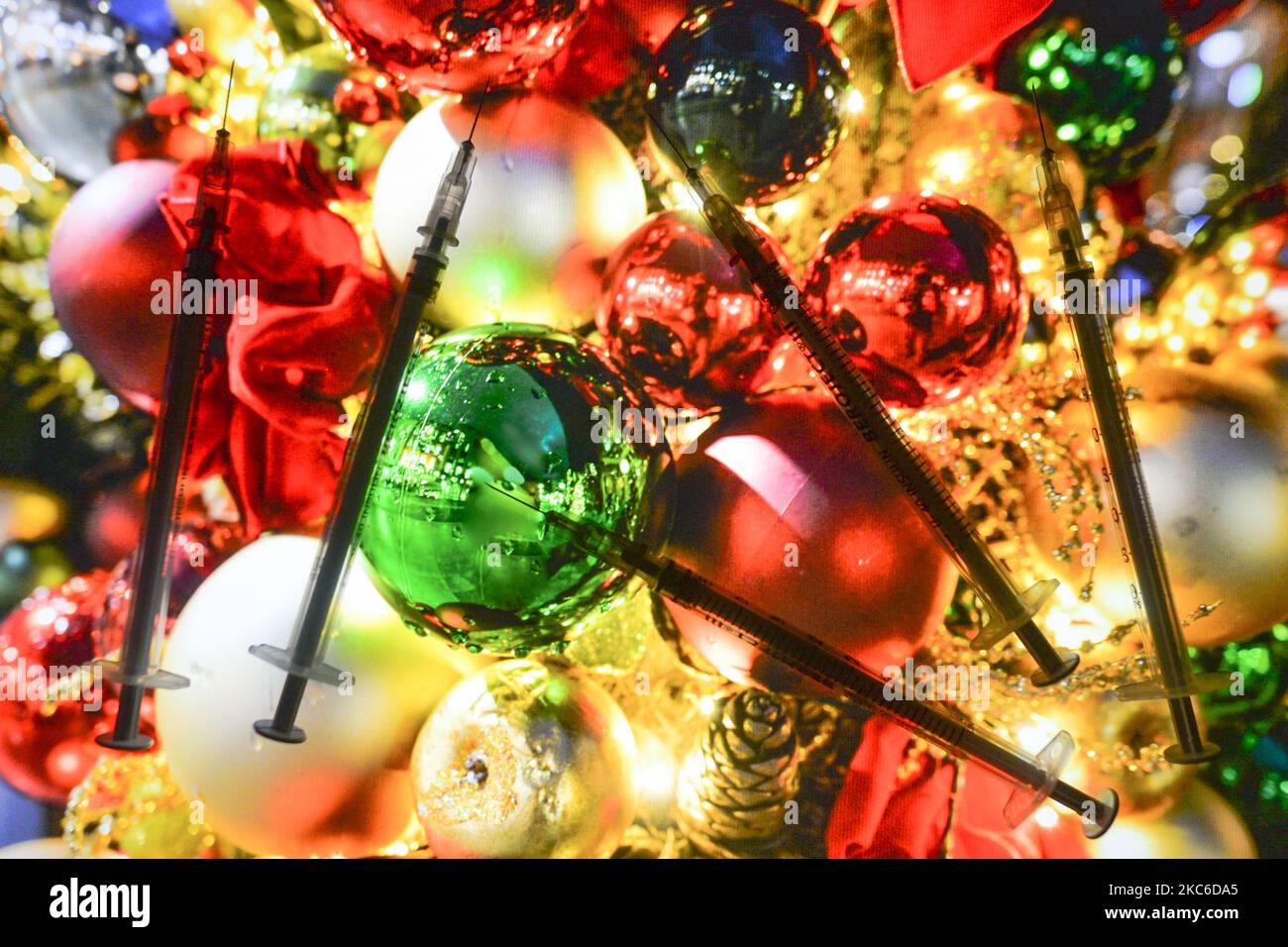 An illustrative photo showing medical syringes seen in front of a shop ...