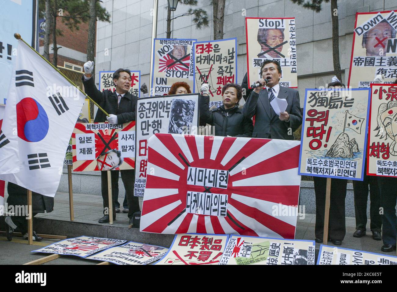 South Korean Protesters shout slogans during an Anti-Japan Rally near ...