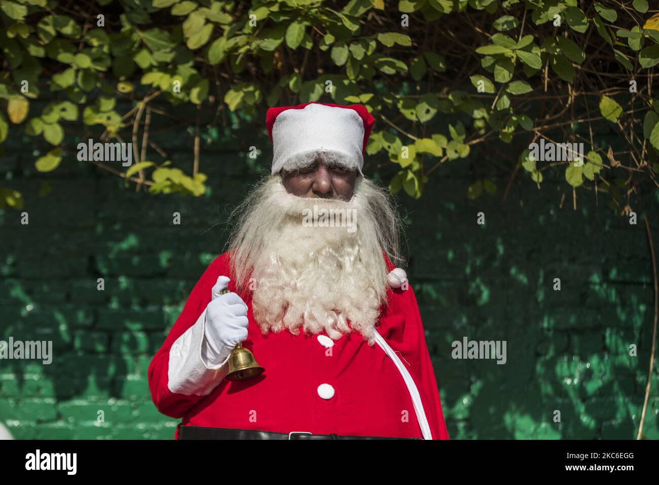 Santa Claus pose for a portrait at Sonargaon Hotel premises on the eve ...