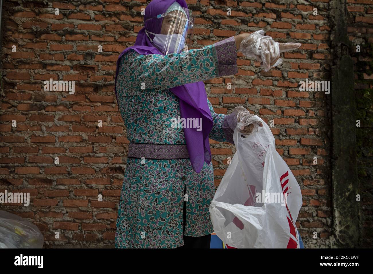 People collect garbages at Garbage Bank Collection in Pamulang, South ...