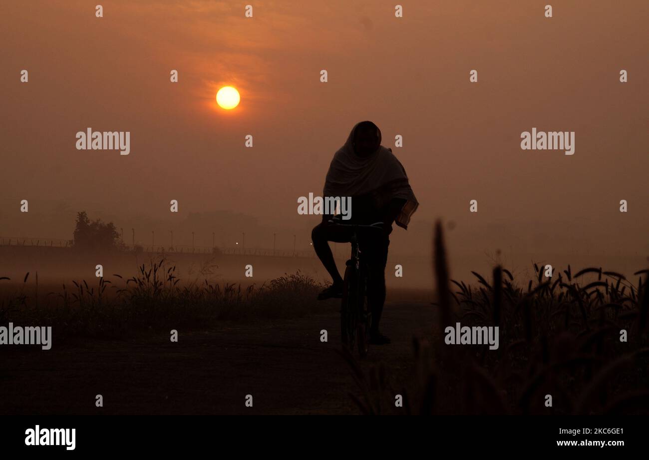 Local residents are seen on their native road as they walks out in a ...