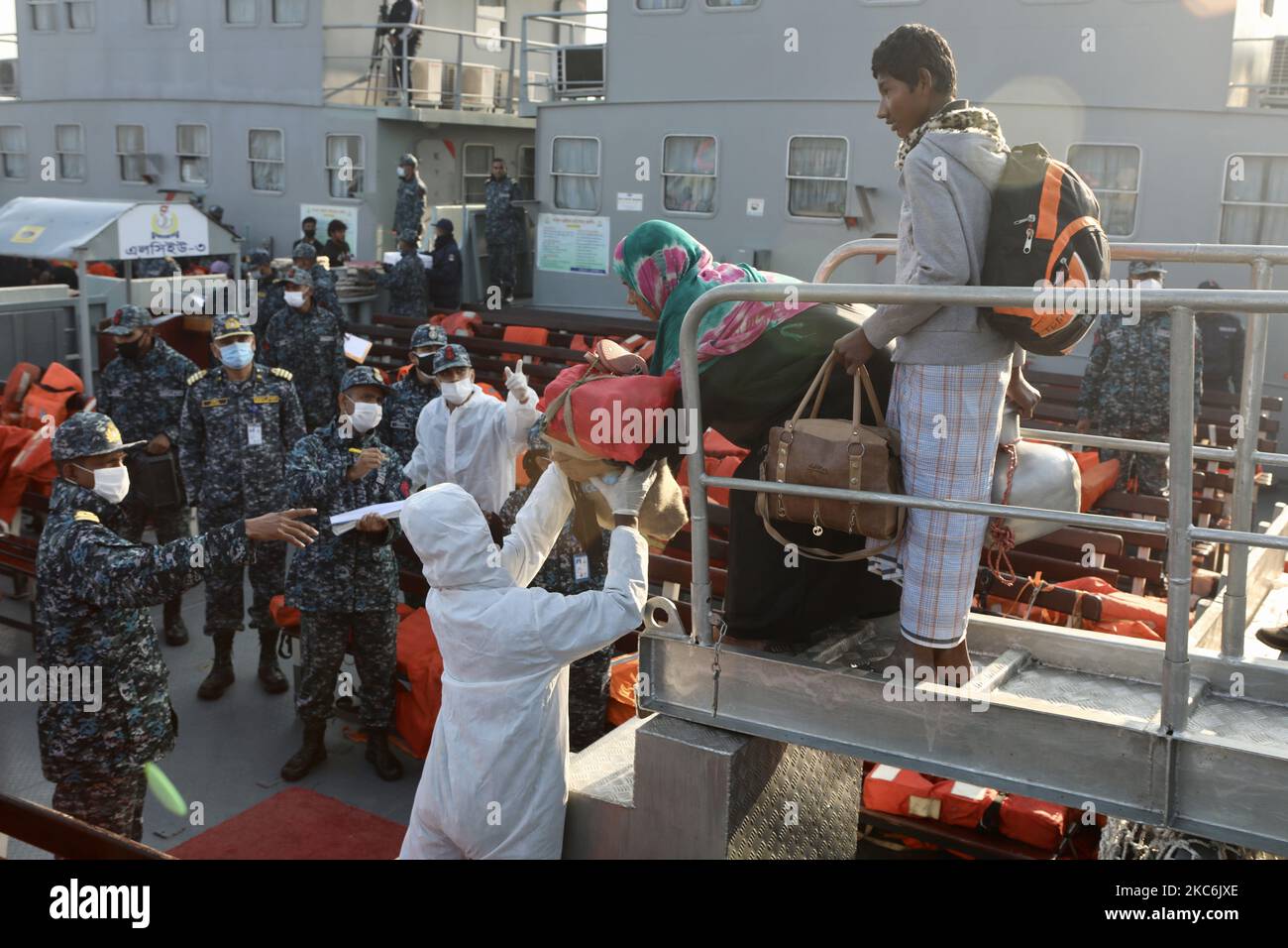 Rohingyas prepare to board a ship as they move to Bhasan Char island ...