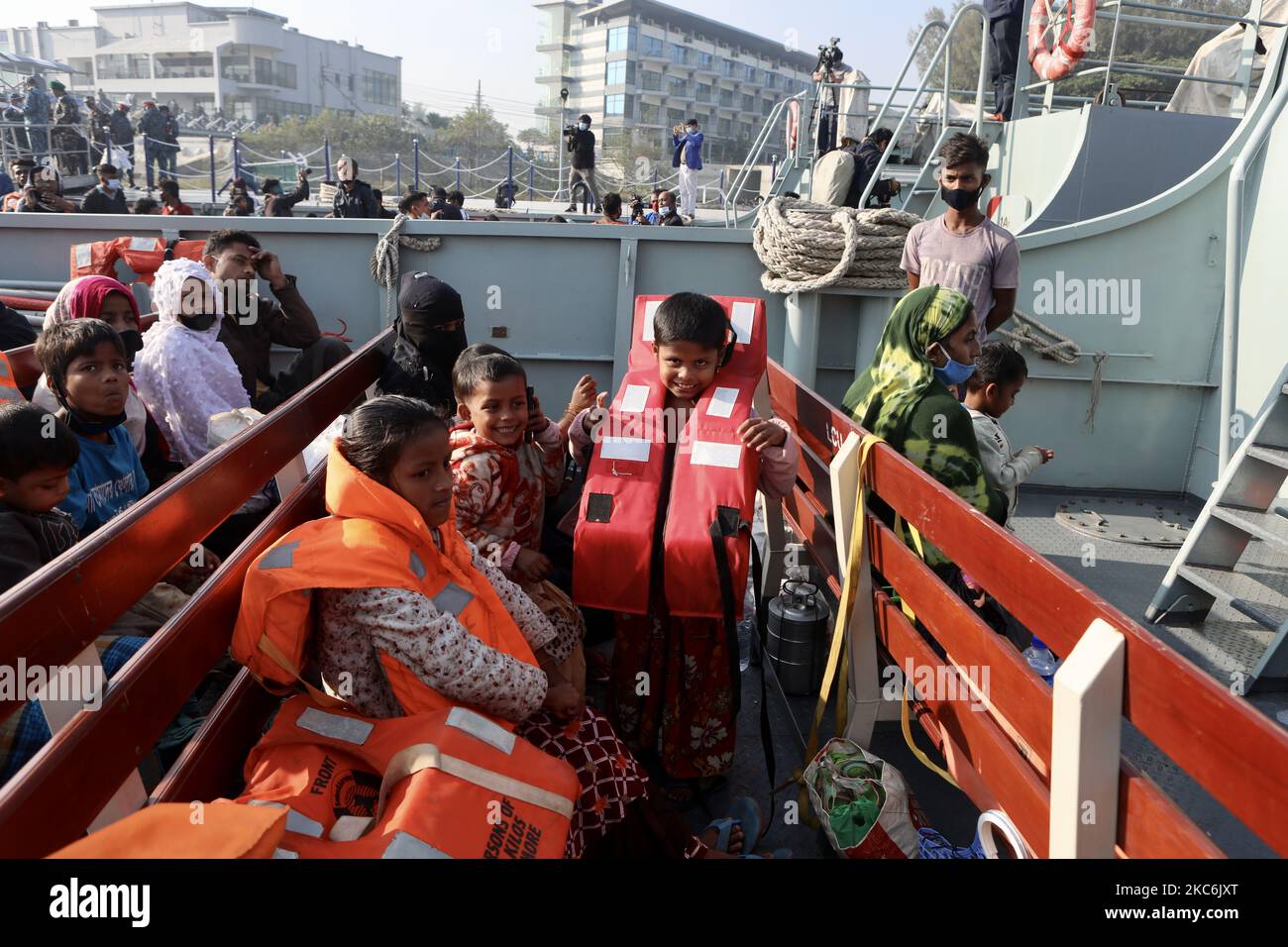 Rohingyas prepare to board a ship as they move to Bhasan Char island ...