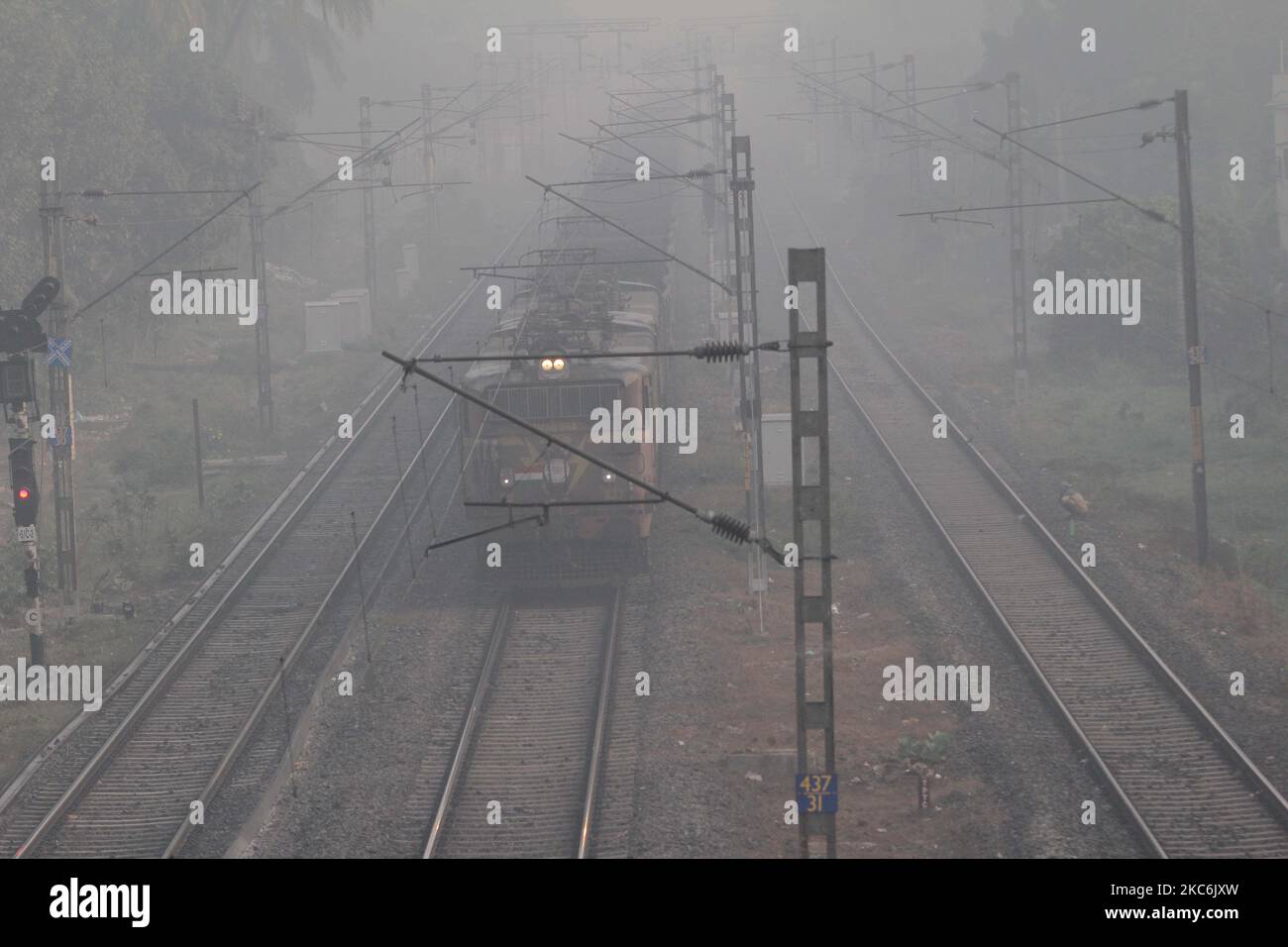 Fog enveloped in the railway tracks in today's chilly morning as trains ...