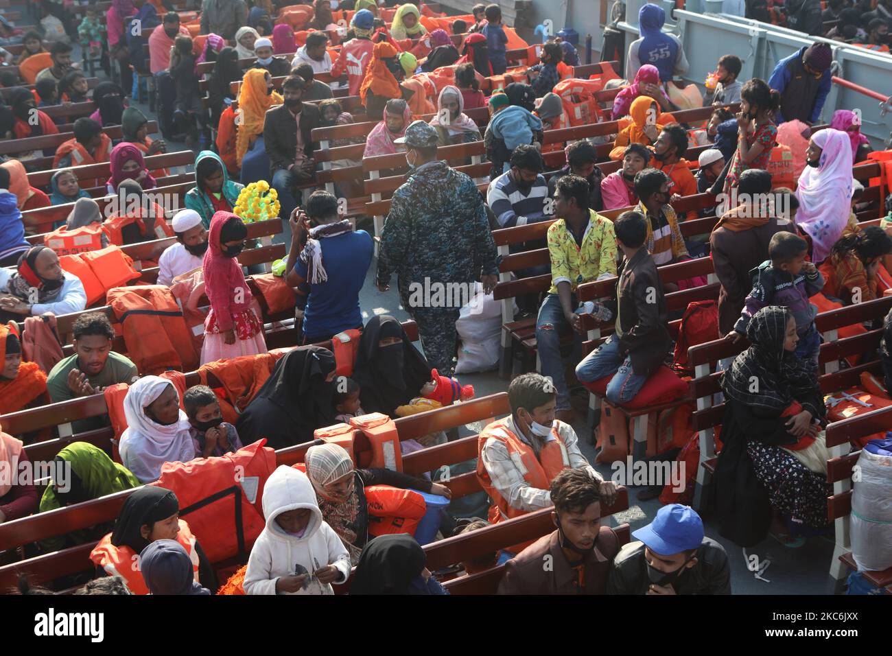 Rohingyas prepare to board a ship as they move to Bhasan Char island ...