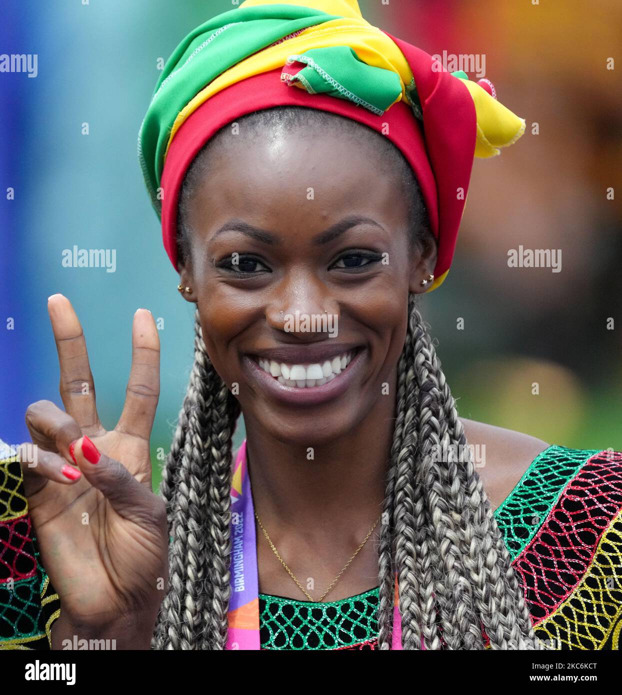 A closeup of an African woman smiling at the camera during the 2022 ...