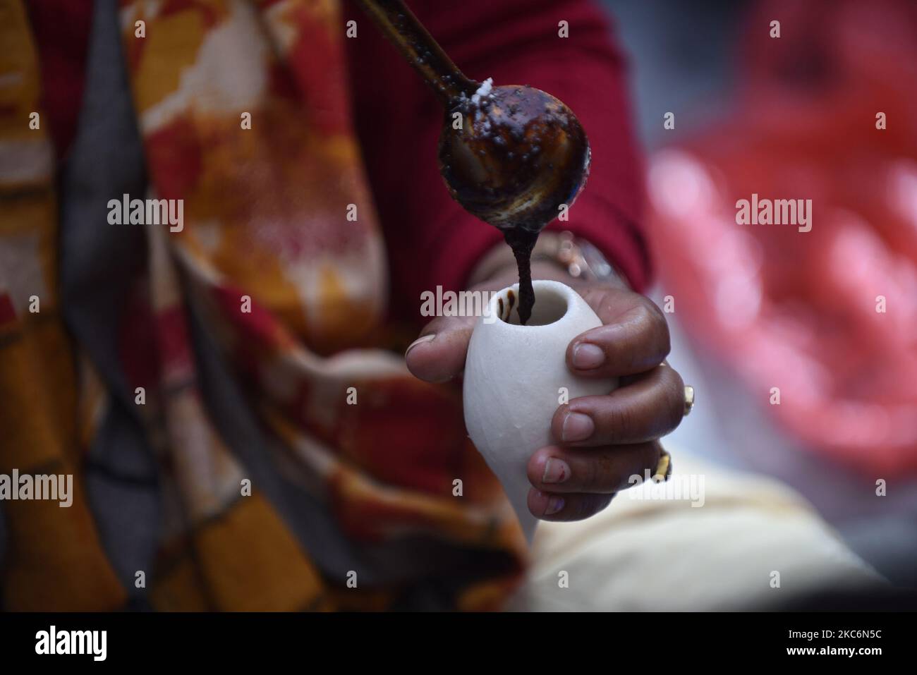 A woman making Yomari during Yomari Punhi in Kathmandu, Nepal on ...