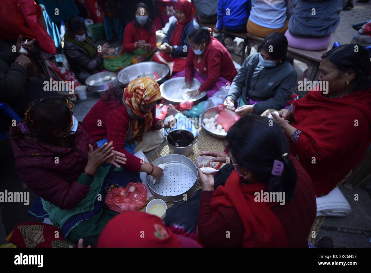 A Group of Newari woman making Yomari during Yomari Punhi in Kathmandu ...