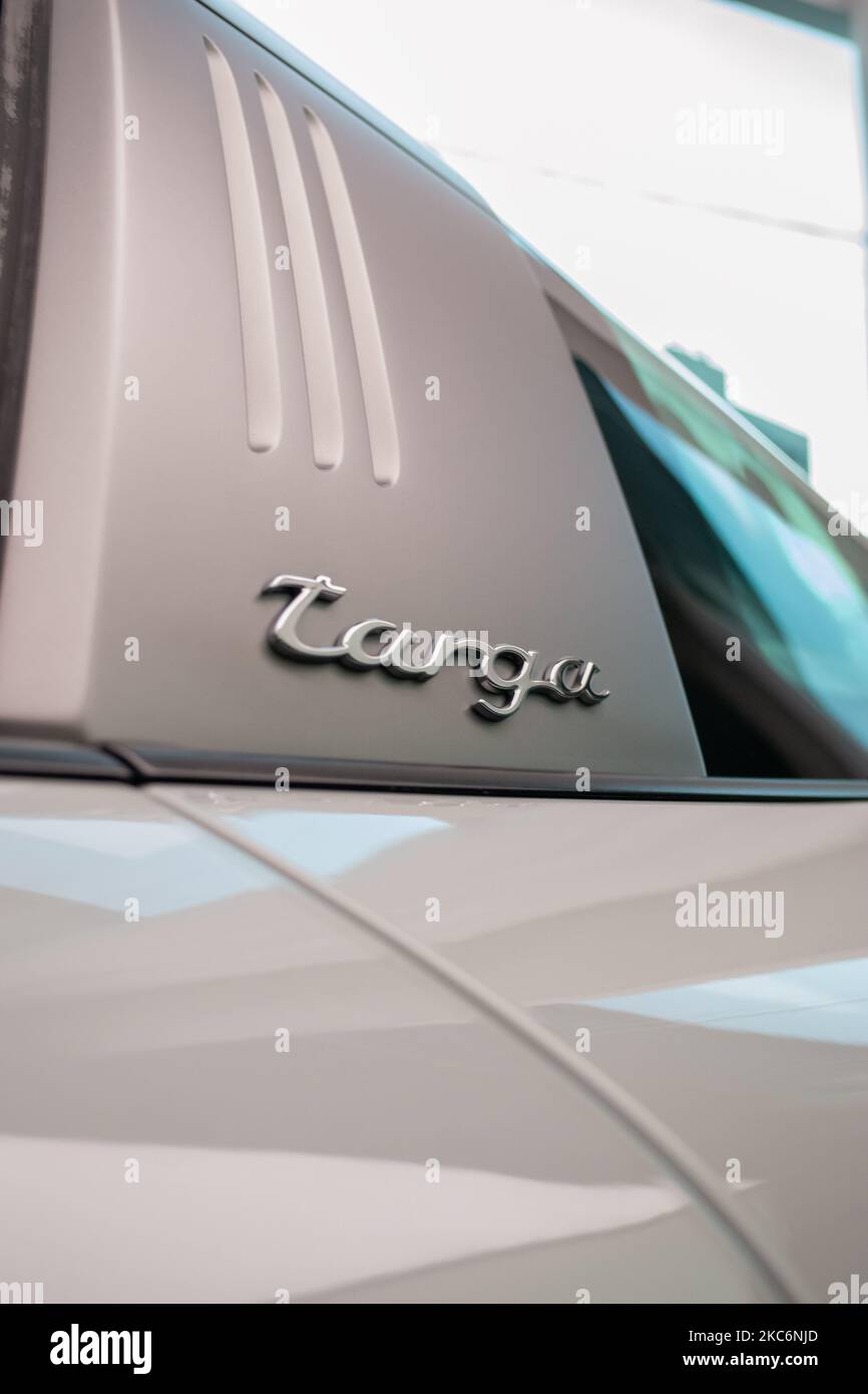 A vertical closeup on a Porsche 911 Targa B pillar badge Stock Photo ...