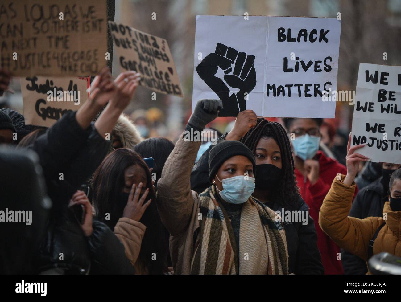 People seen during a candlelit vigil and protest for George Nkencho ...