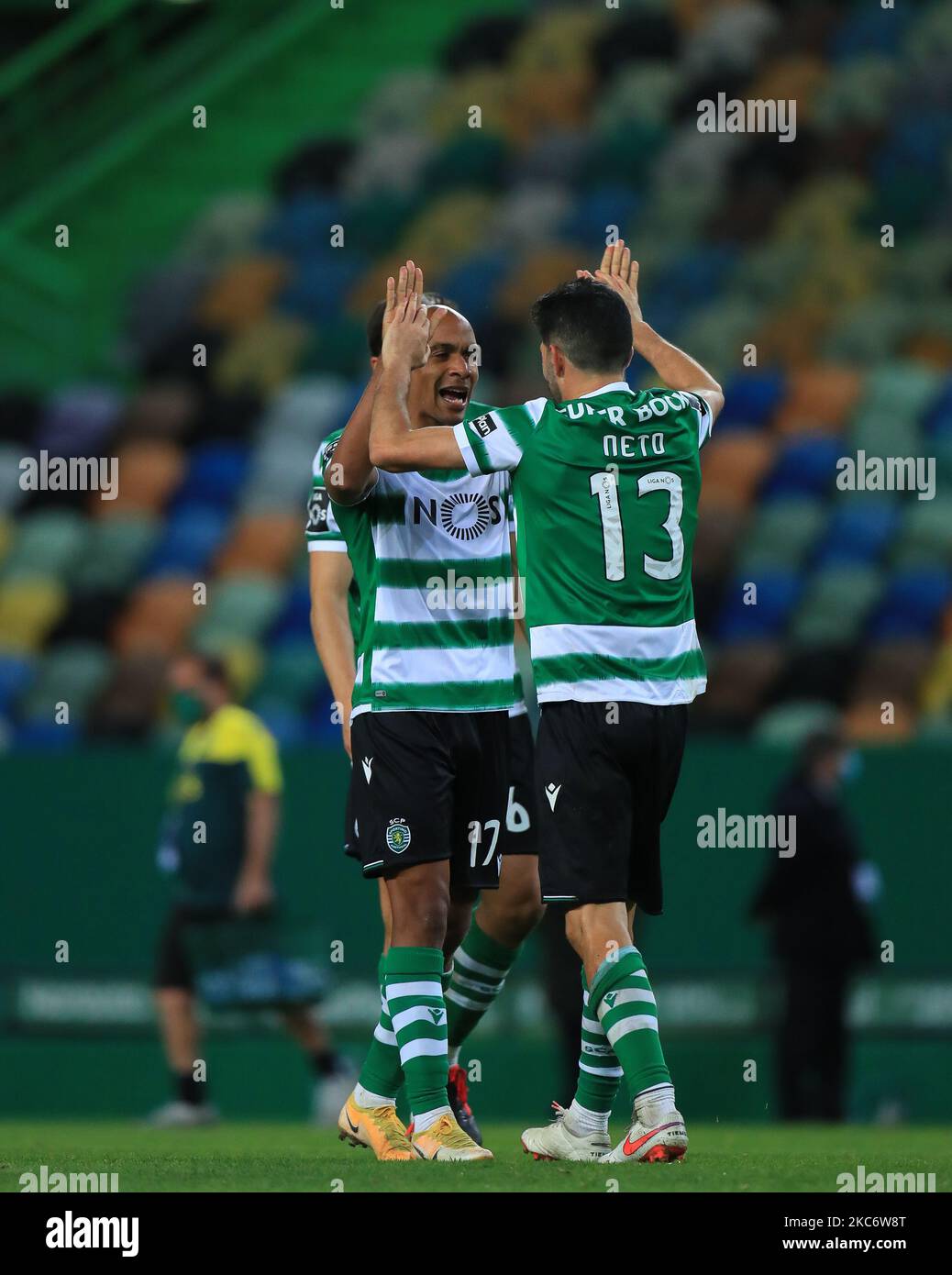 Joao Mario and Luis Neto of Sporting CP celebrates victory during the ...