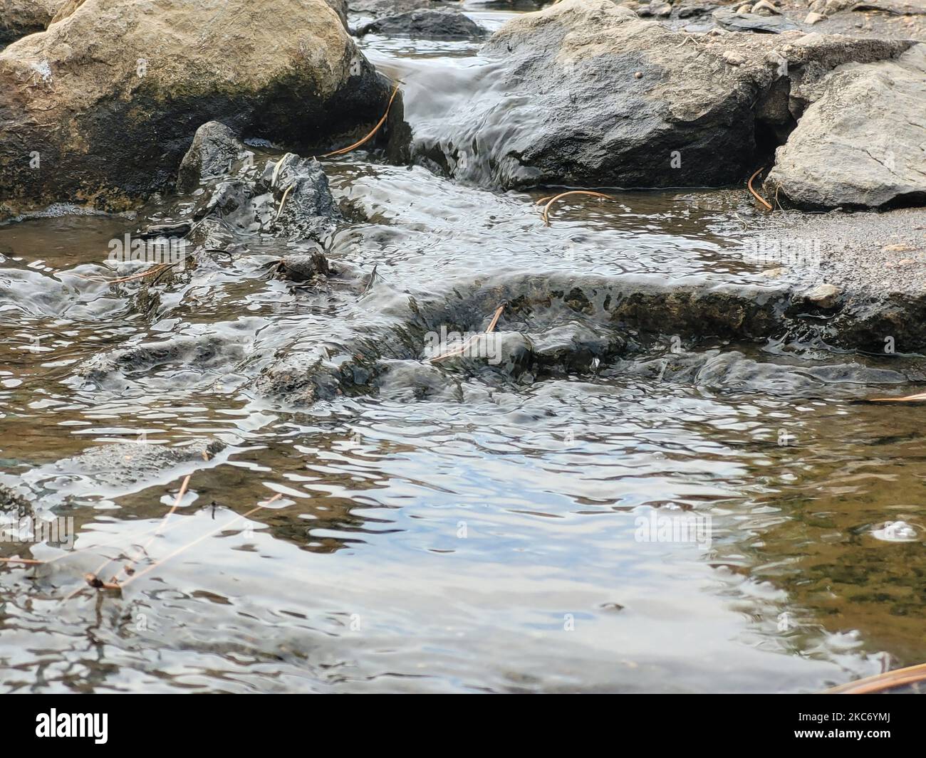 The river water falling between stones Stock Photo - Alamy