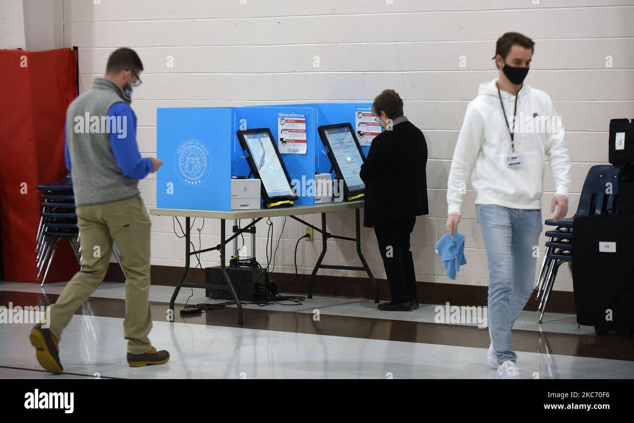 Voters are seen at a polling place at Varnell gymnasium on January 5 ...