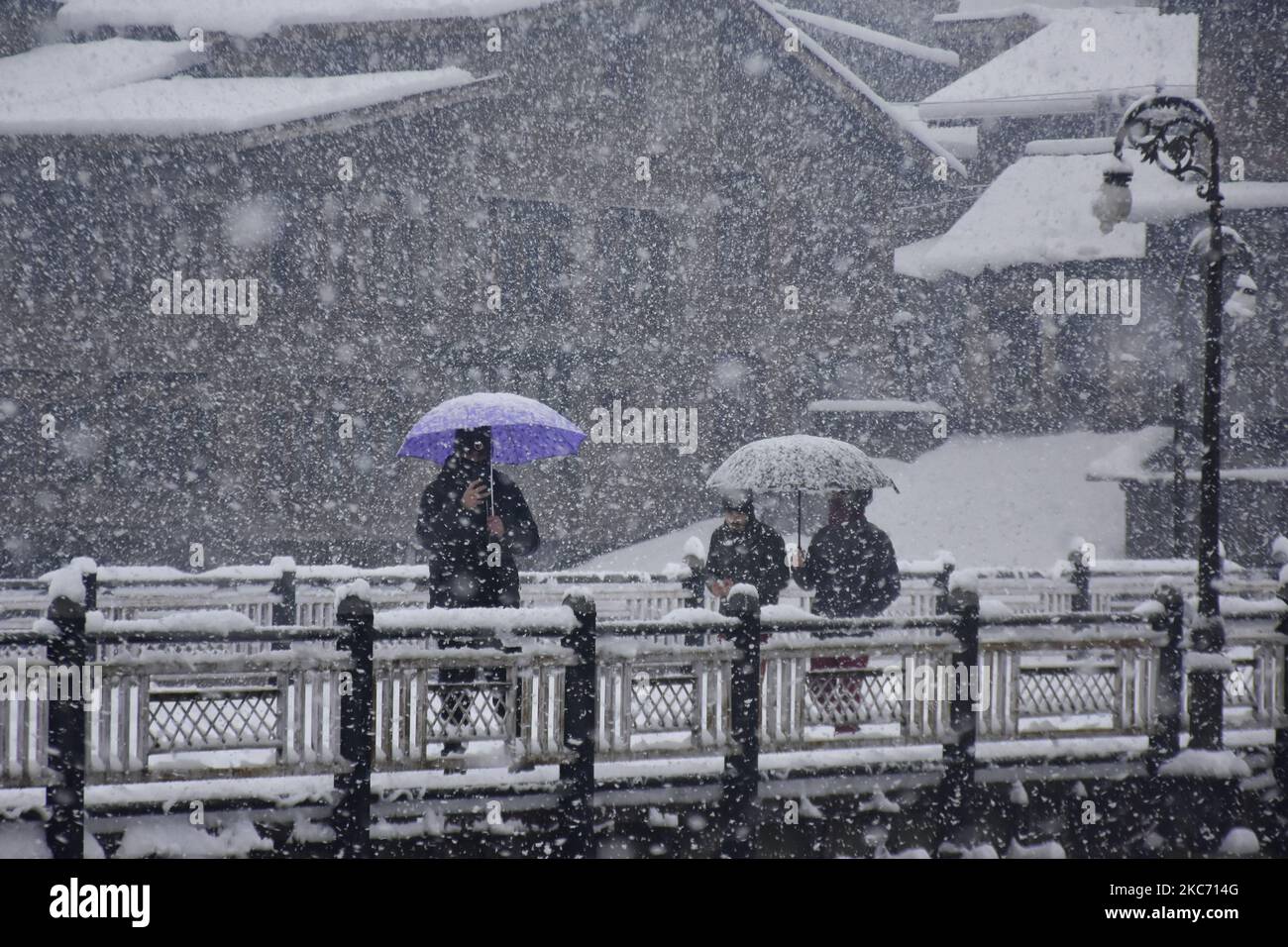 People walk amid heavy snowfall as snowfall contimues for third day in ...