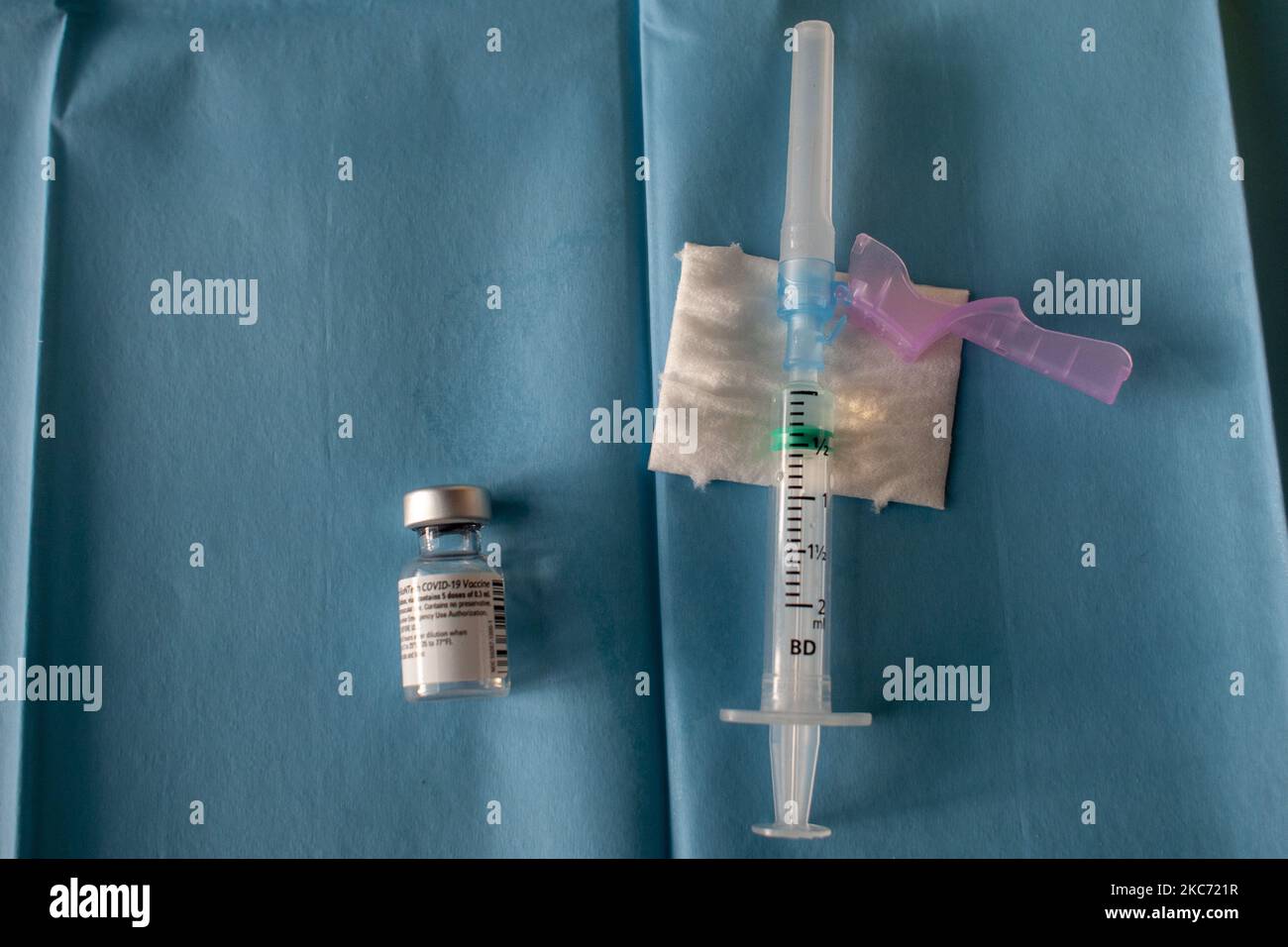 Pfizer vaccine container and a prepared dose for a patient. On January ...