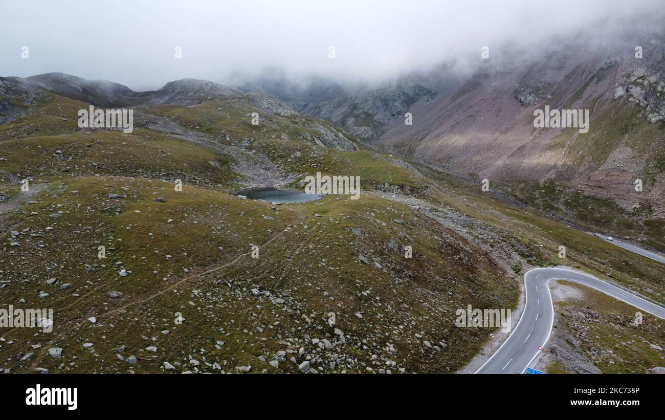 An aerial view of Timmelsjoch pass road on a foggy day in South Tyrol ...