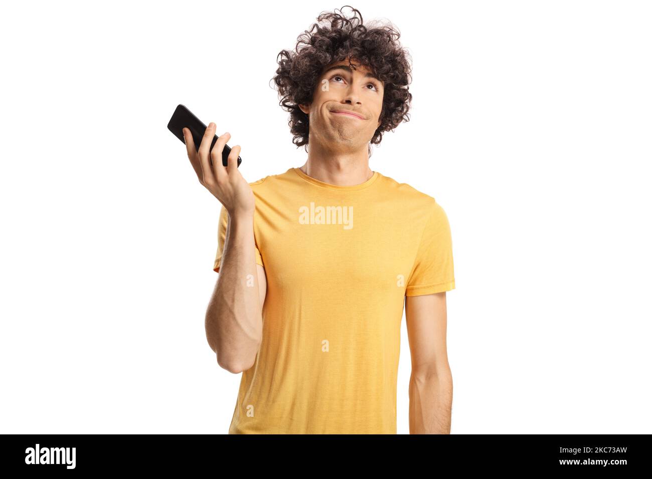 Bored guy listening to phone conversation on speakerphone and holding ...