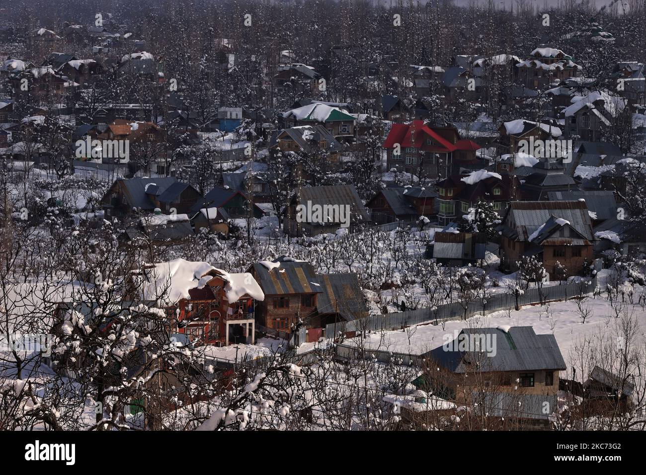 Rooftop of buildings are covered with snow at Tangmarg area of district ...