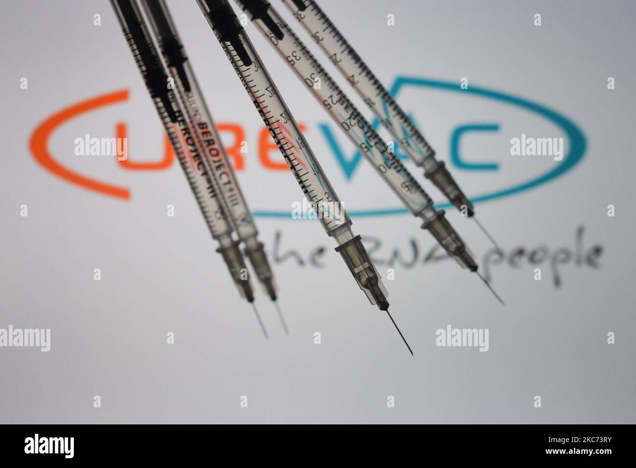 An illustrative image of medical syringes in front of CureVac logo ...