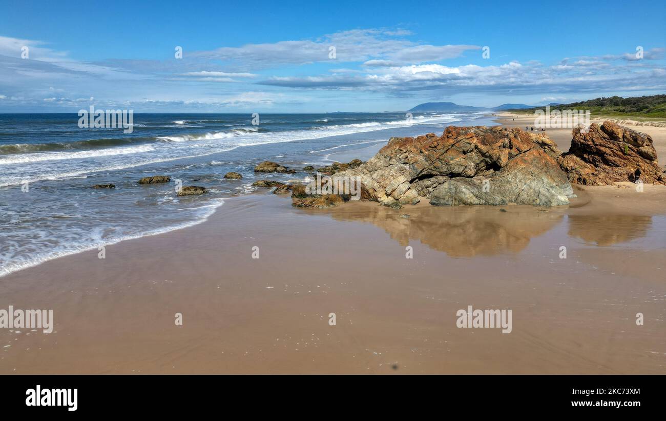 A scenic view of a body of water near the shore under the bright ...