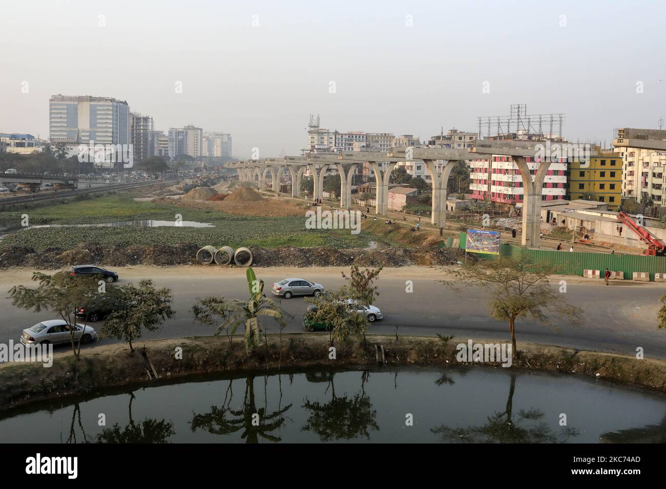 Bangladeshi workers preparing reinforcing steel at a construction site ...