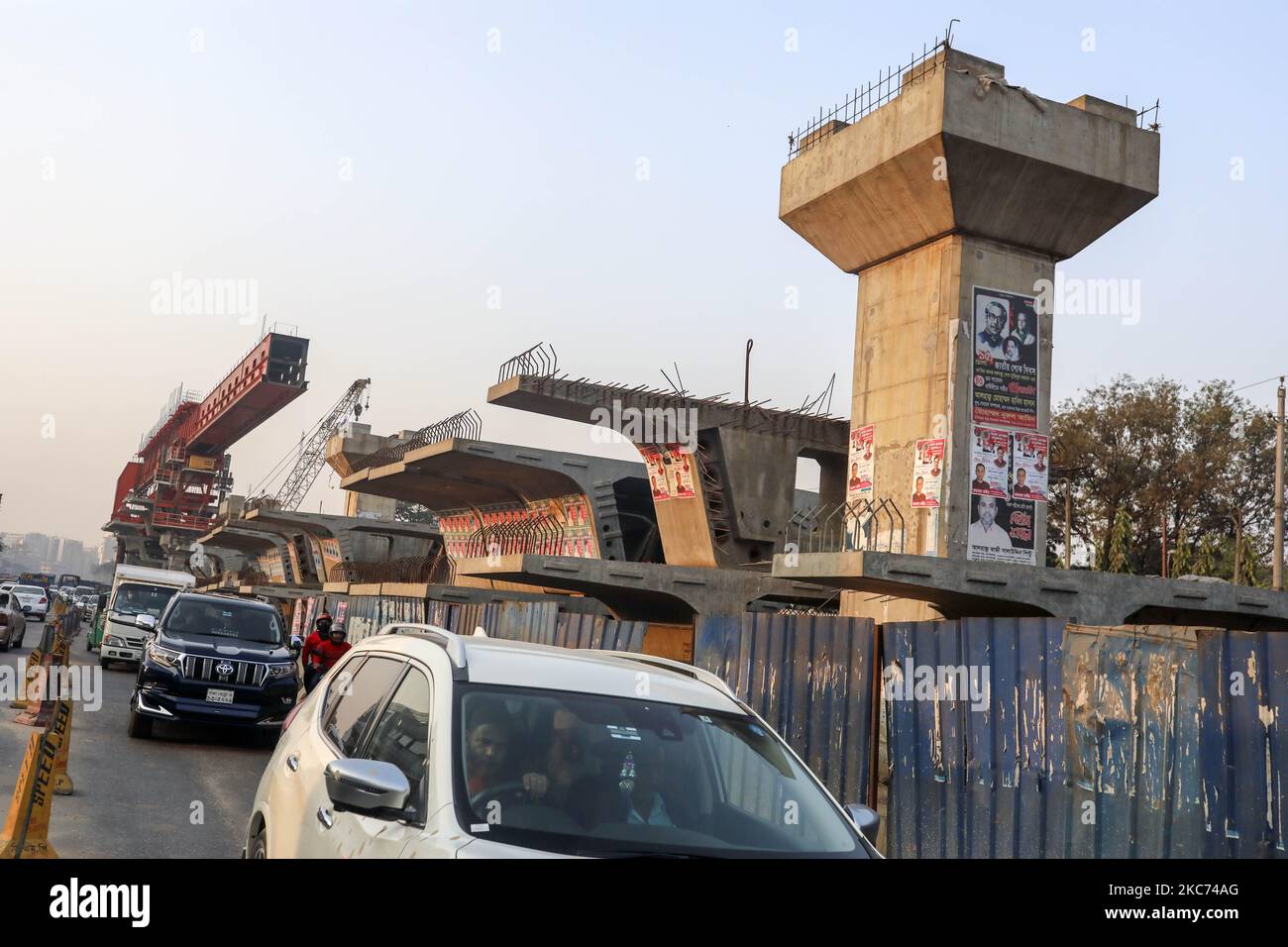 Bangladeshi workers preparing reinforcing steel at a construction site ...