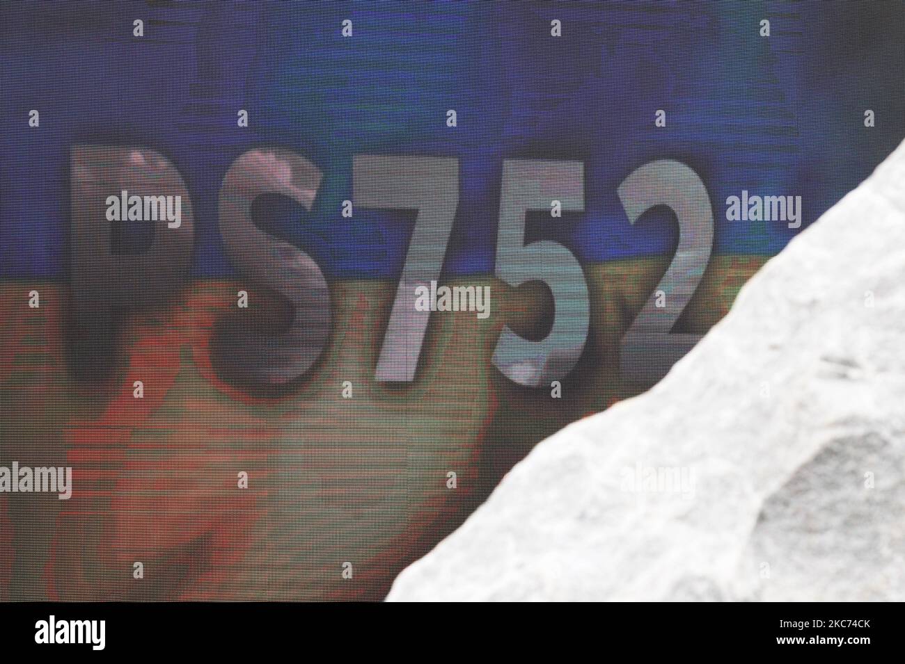 A screen is seen during an honoring ceremony in the memory of victims ...