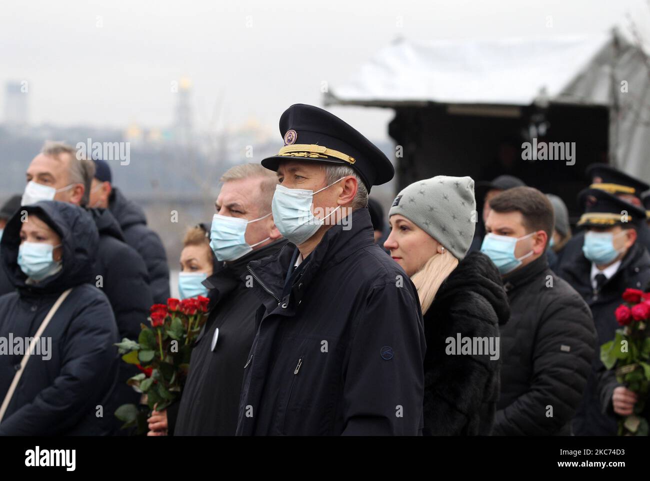 Relatives, friends, and colleagues attend an honoring ceremony in the ...