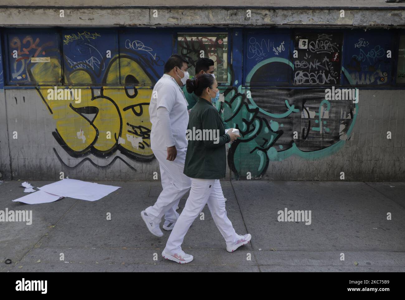 Medical personnel walk outside the facilities of the Centro Médico ...