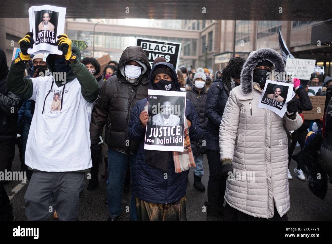 Protesters and family members of Dolal Idd march through downtown ...