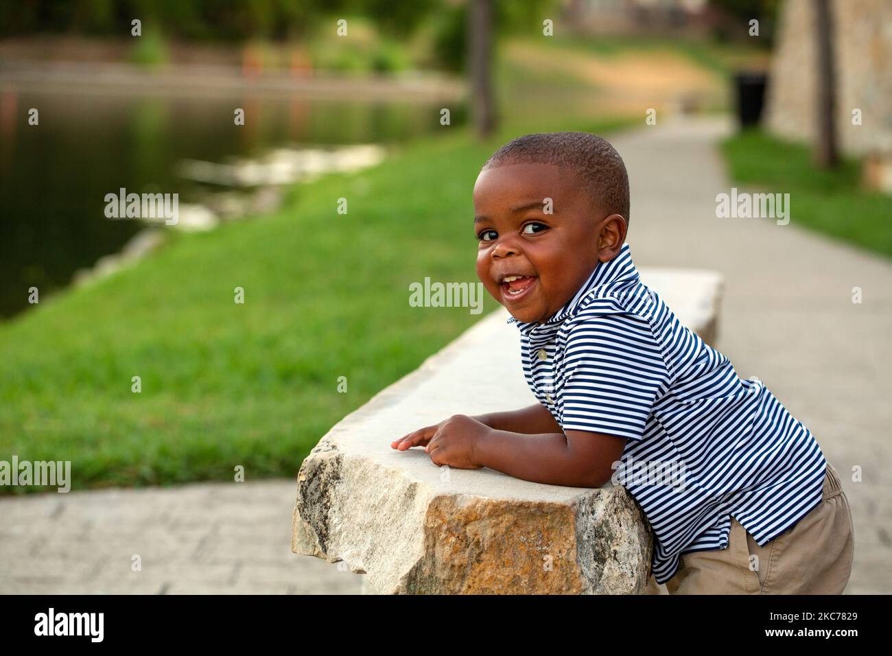 African American little boy outside smiling Stock Photo - Alamy