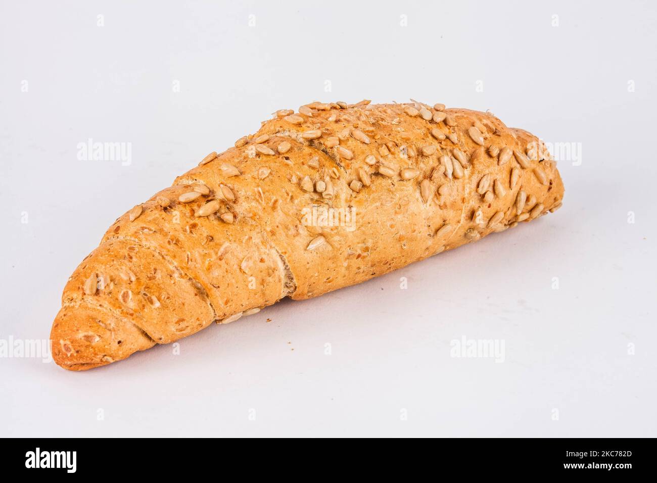 A bread with sunflower seeds isolated on a white background Stock Photo ...
