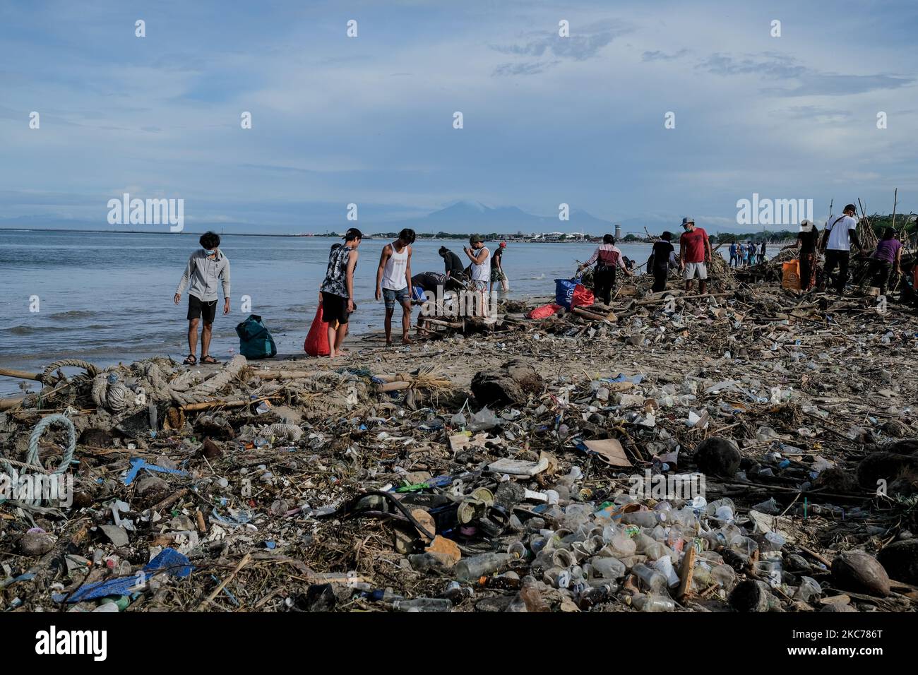 Hundreds of Jimbaran villagers worked together to clean up tens of tons ...