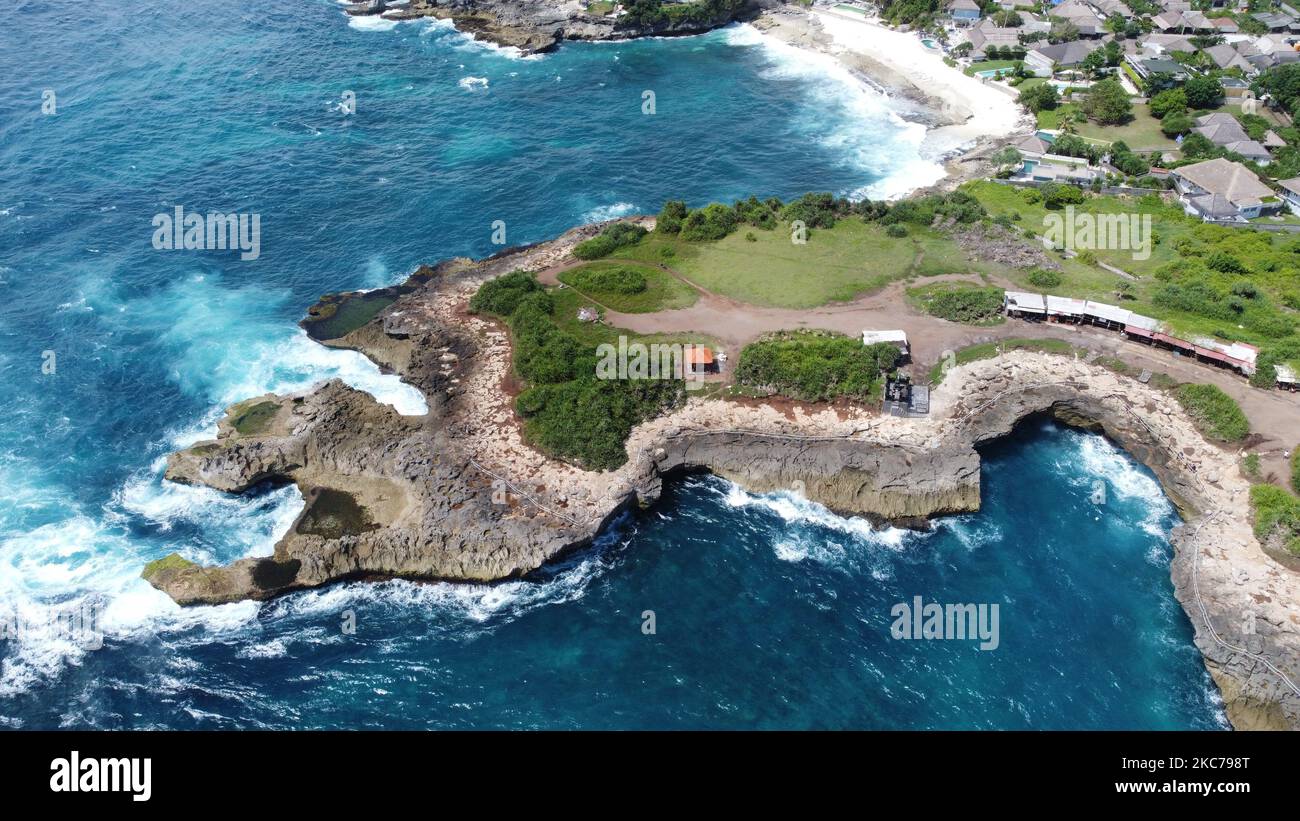 The view of the rocky shoreline with green vegetation. Bali, Indonesia ...