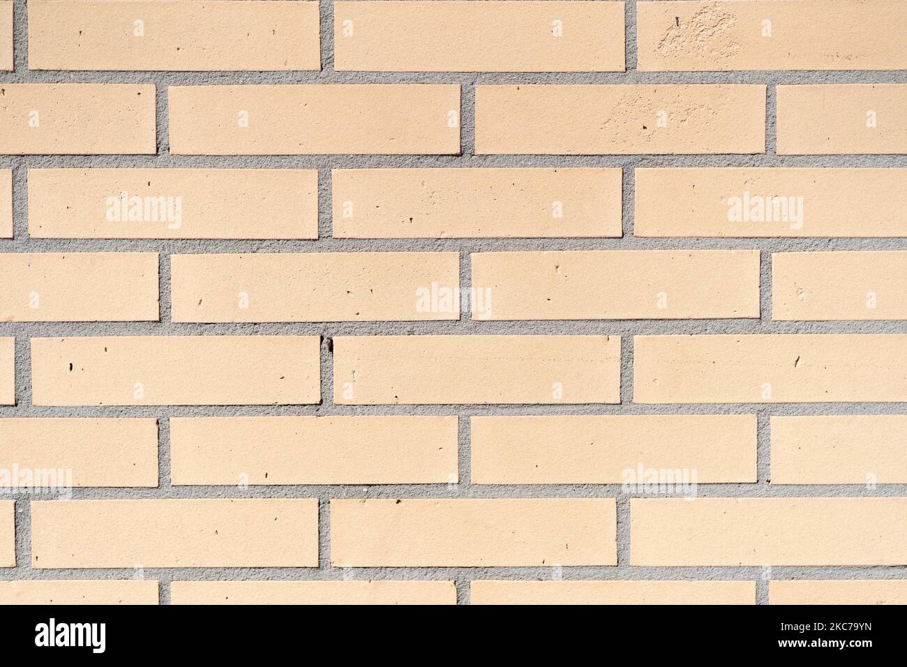 A closeup shot of a cream white brick wall, perfect for backgrounds and ...