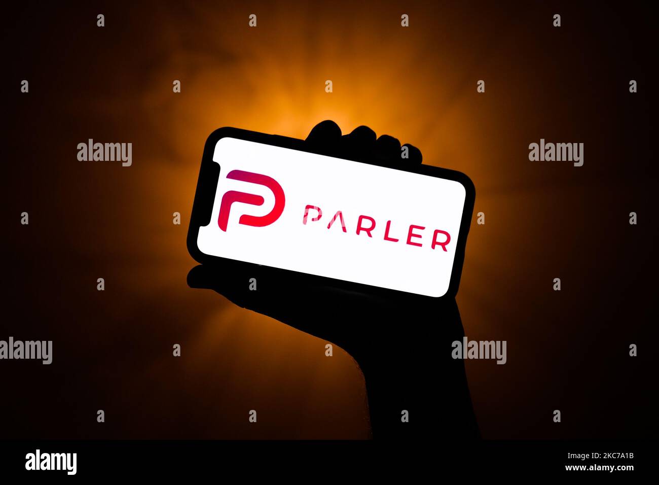 Parler app logo displayed on a phone screen is seen in this ...