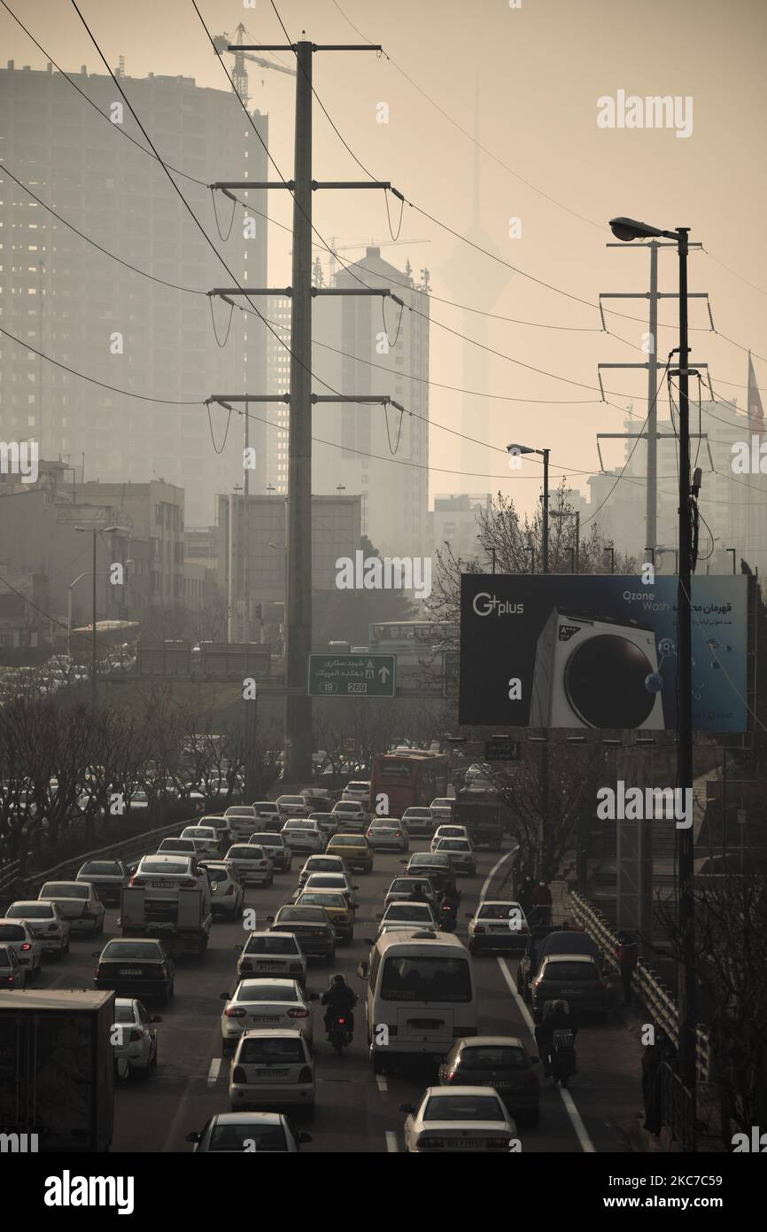 Vehicles travel on a road in northern Tehran during a polluted air ...