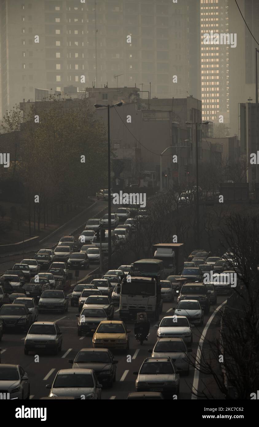 Vehicles travel on a road in northern Tehran during a polluted air ...