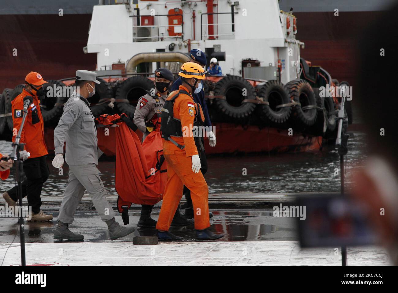 Indonesian National Search And Rescue Agency personnels carries the ...