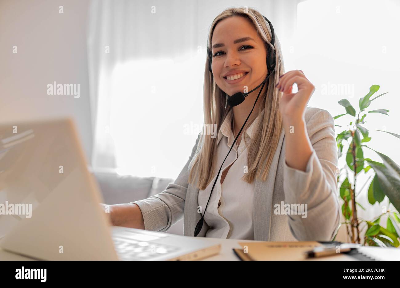 Young woman working in call center. Customer support woman in office ...
