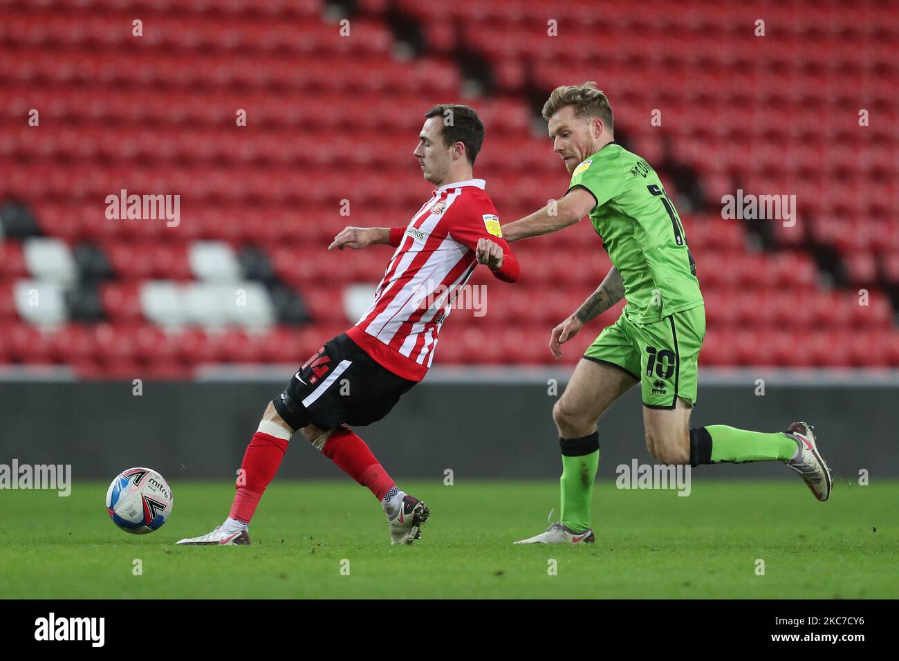 Josh Scowen of Sunderland in action with Tom Conlon of Port Vale during ...