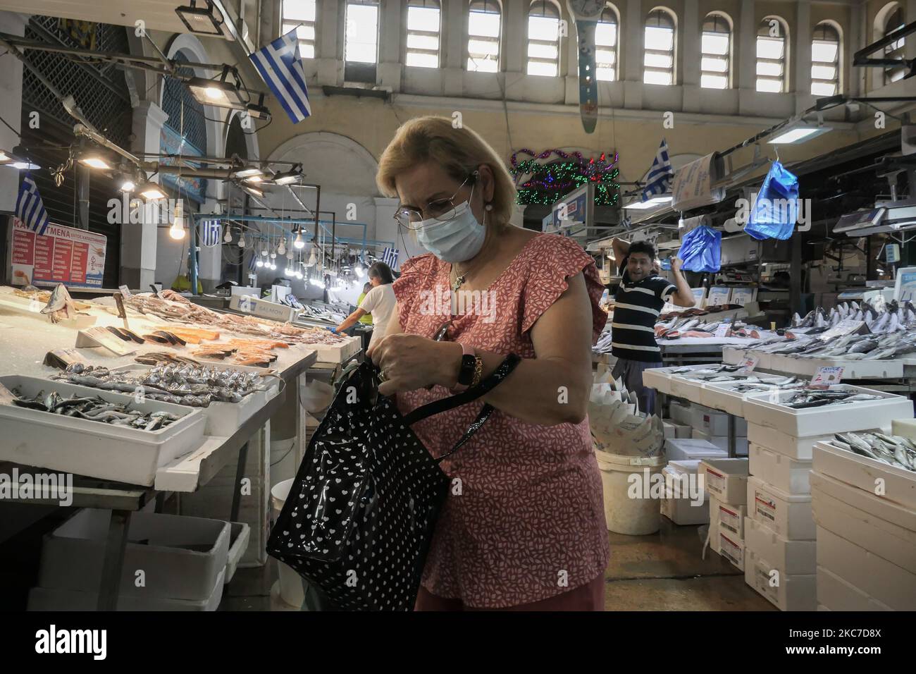 Daily life scene in the Varvakios central fish market in downtown ...