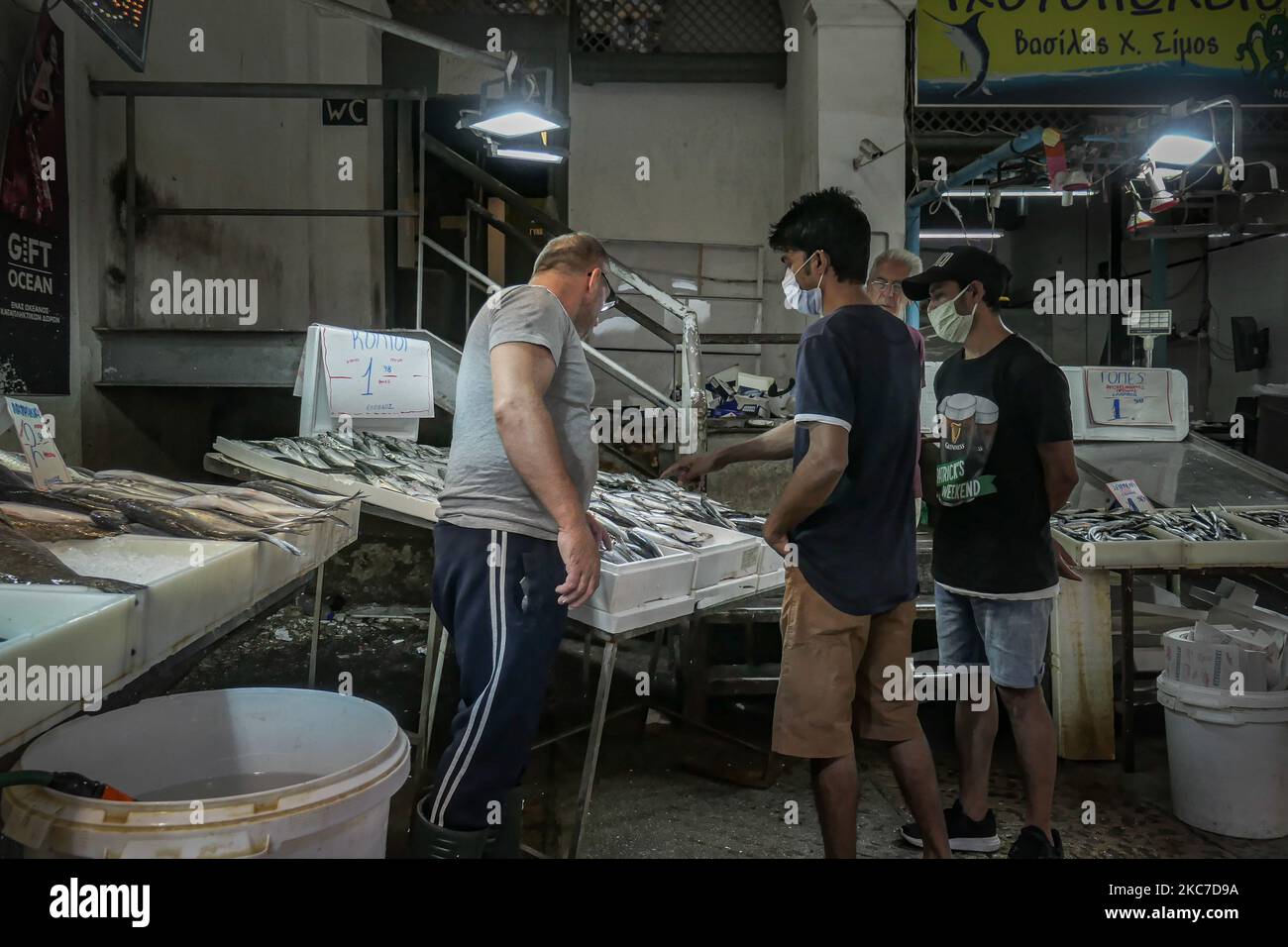 Daily life scene in the Varvakios central fish market in downtown ...