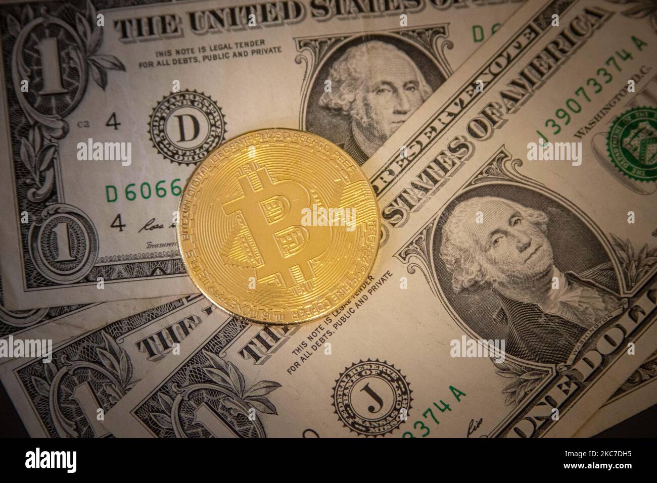 Bitcoin golden physical coin illustration on United States Dollar ...