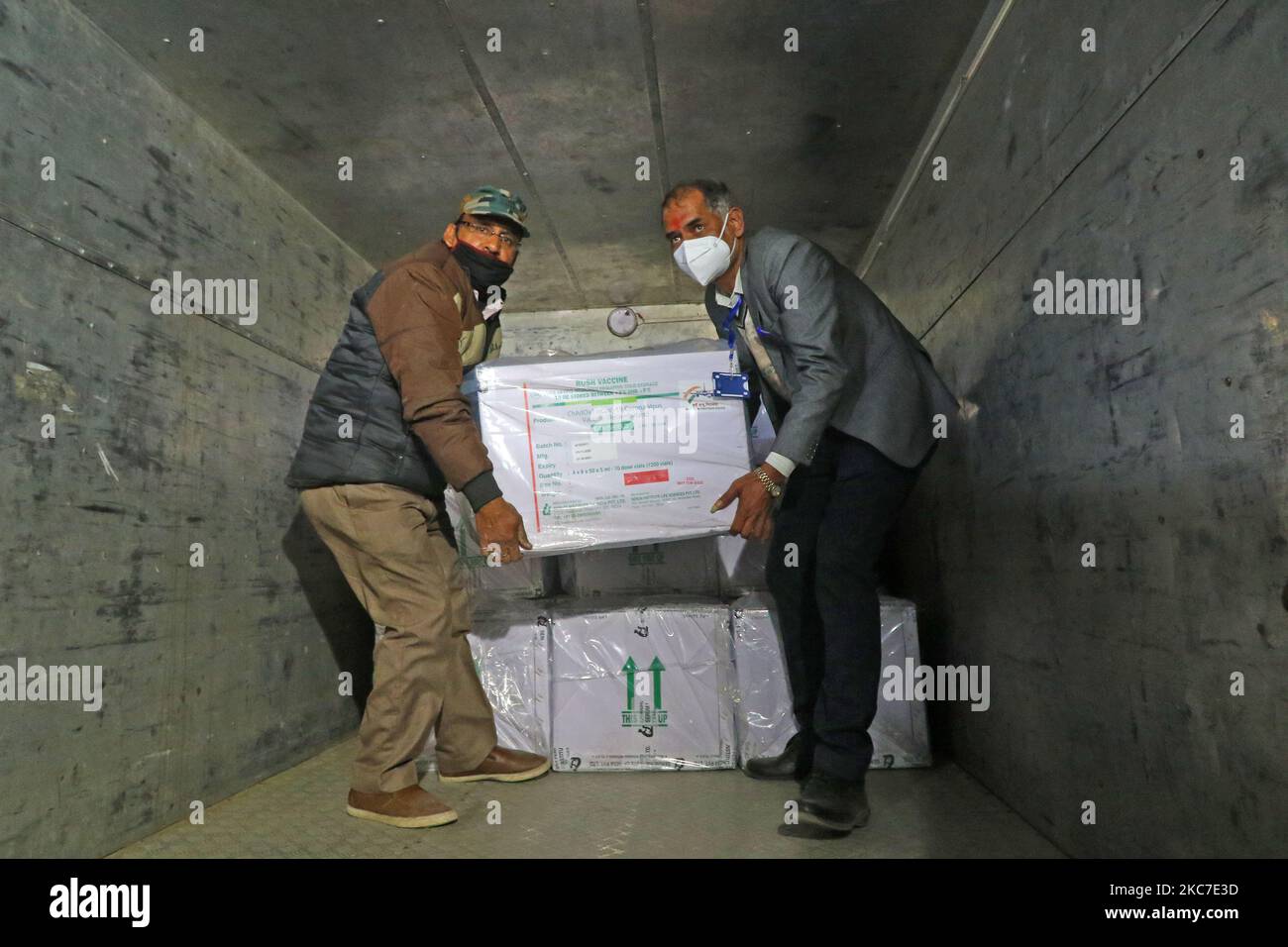 Workers unload the Second consignment of COVID-19 vaccination Serum ...