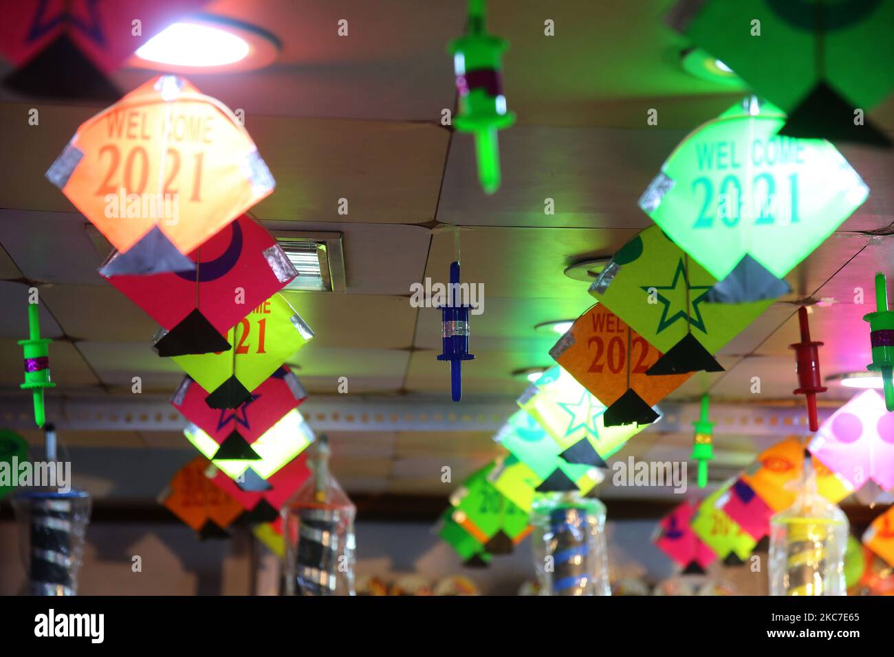 People buy kites at a shop ahead of the Makar Sankranti festival at ...