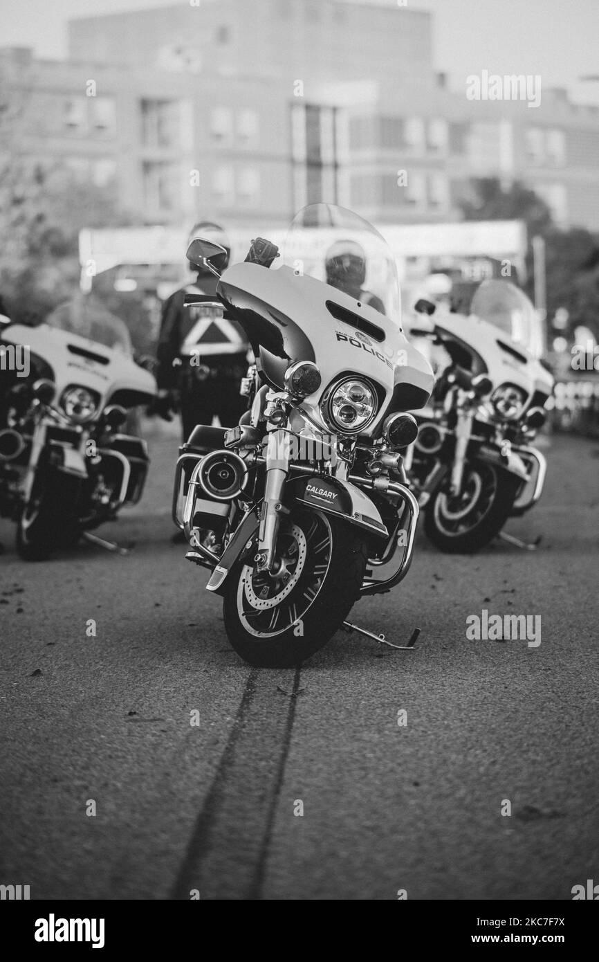 Vertical picture of a police motorcycle parked on the road Stock Photo - Alamy