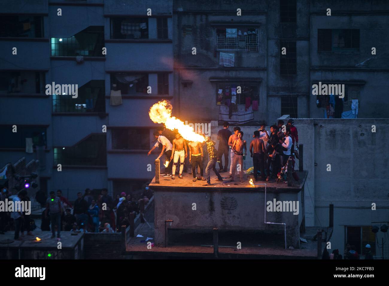 A youth performs fire-eating during the Shakrain festival or the Kite ...