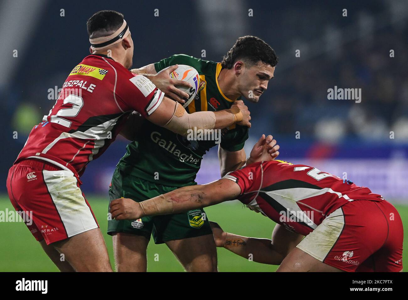Nathan Cleary of Australia is tackled by Charbel Tasipale and Khaled ...